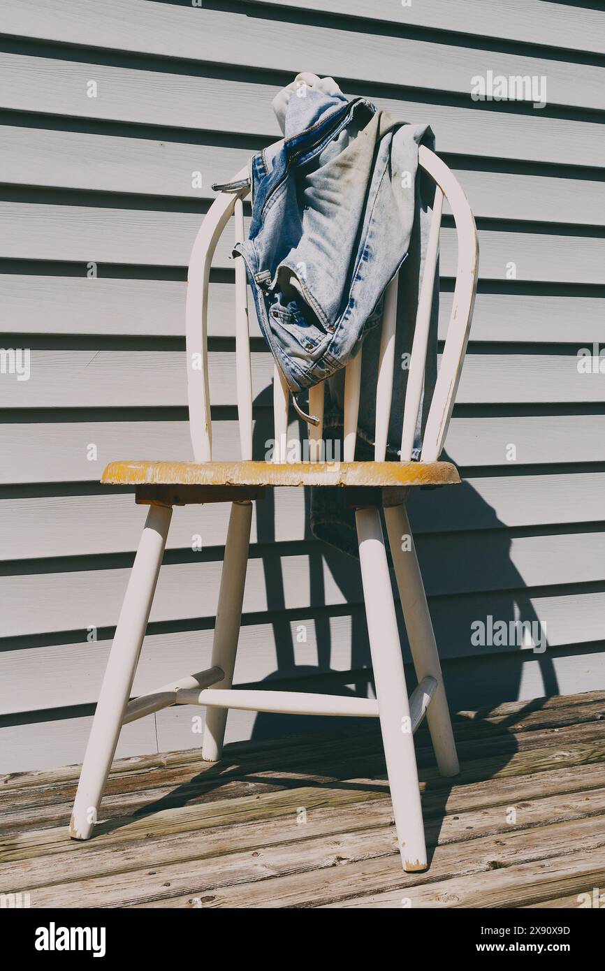 Clothes draped on chair hi-res stock photography and images - Alamy