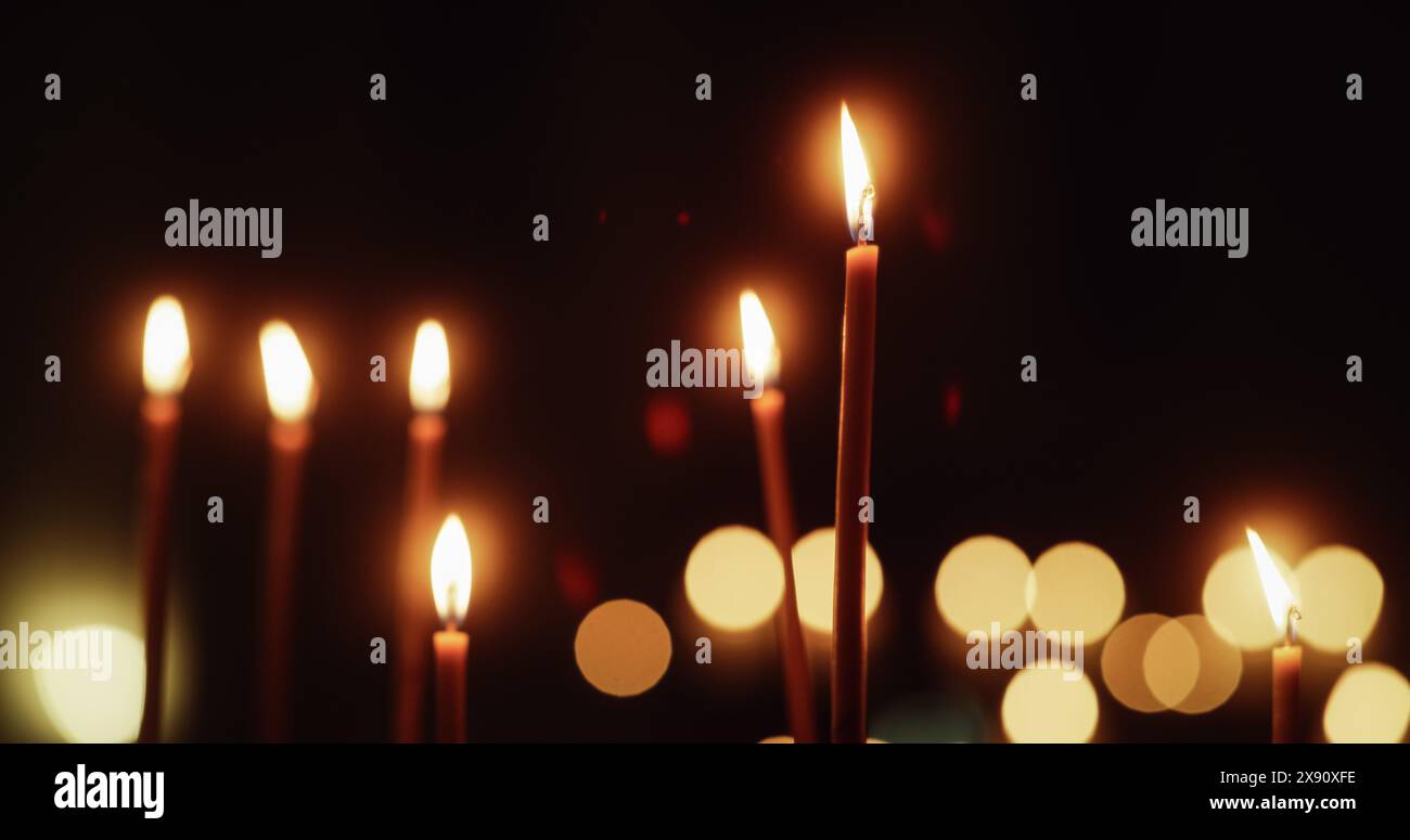 Cinematic Shot of Candles with Flames Burning on Black Background with ...