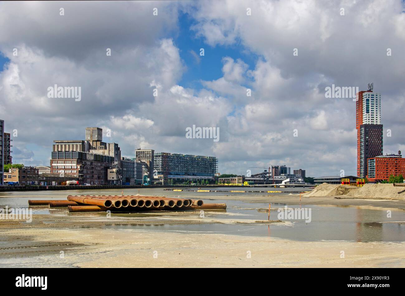 Rotterdam, The Netherlands, May 28, 2024: steel pipes and shallow water ...