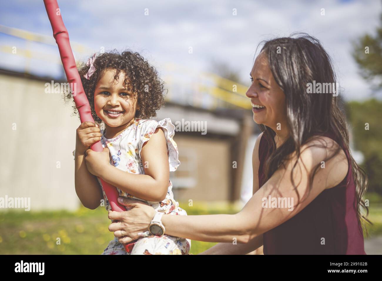Playtime Moments. Mom With Her daughter Having Fun on the Playground ...