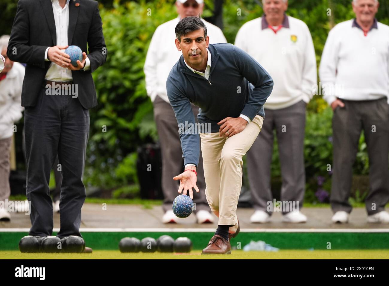 Prime Minister Rishi Sunak plays a game of bowls during a visit to ...