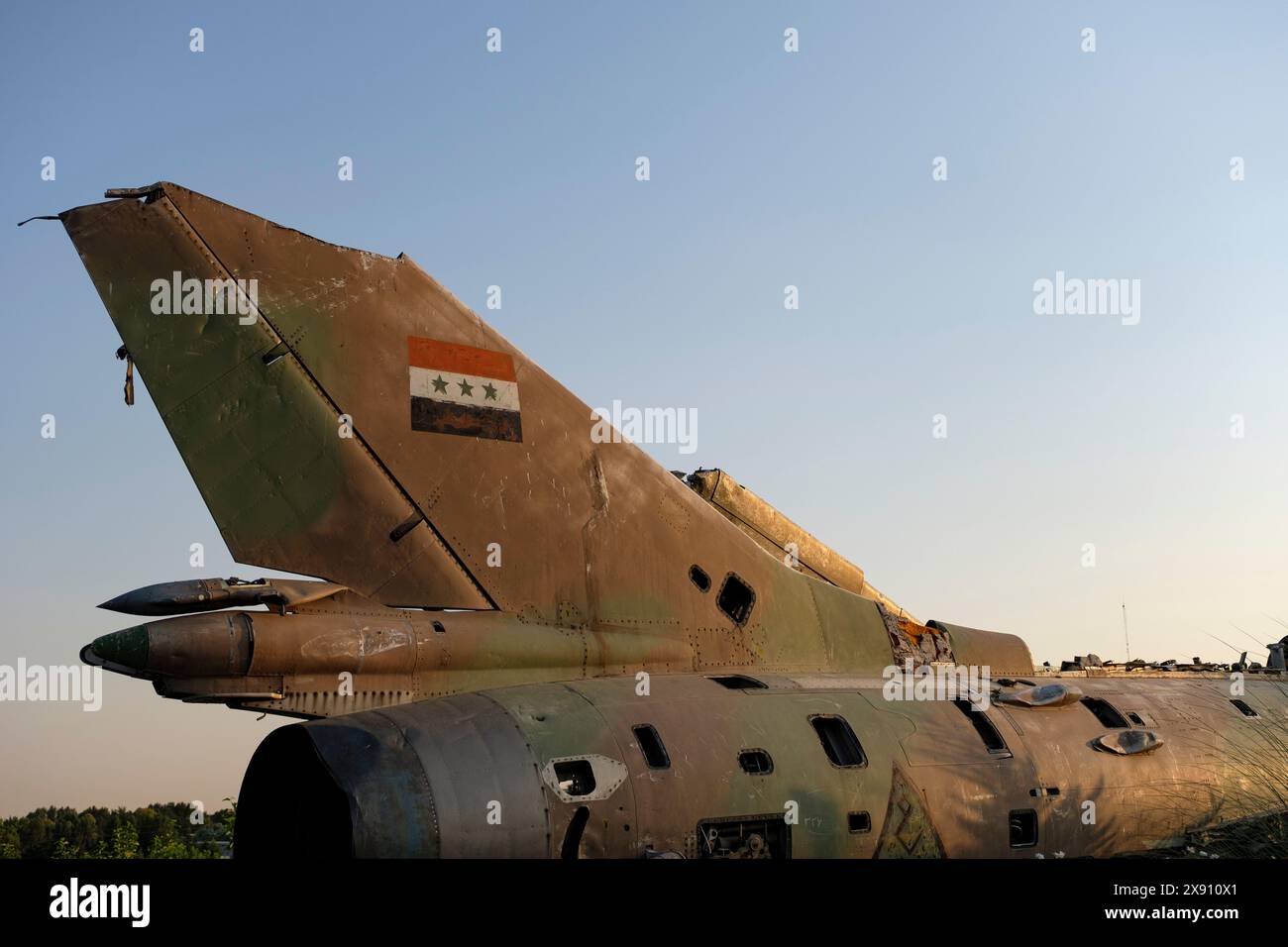 Wrecked and rusty military aircraft with the Iraq Flag is left over ...