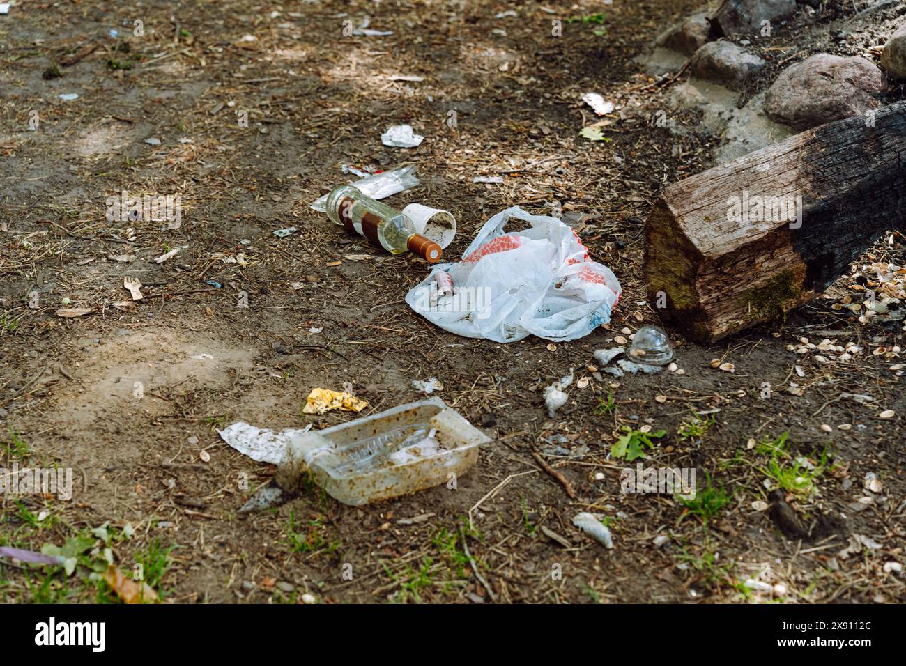 Various garbage, plastic bags, containers, bottles and food waste are ...