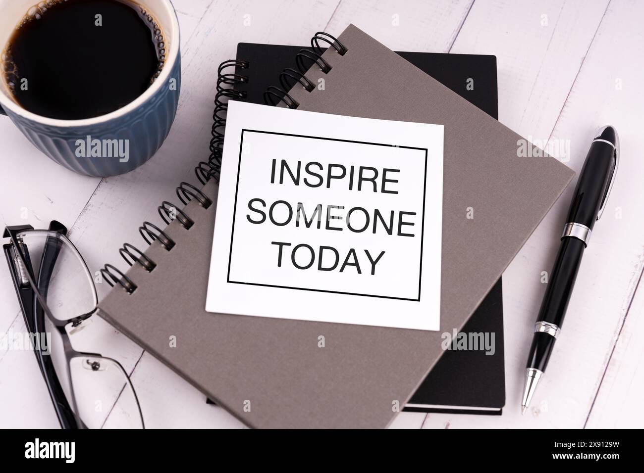 Paper note with text inspire someone today Stock Photo - Alamy