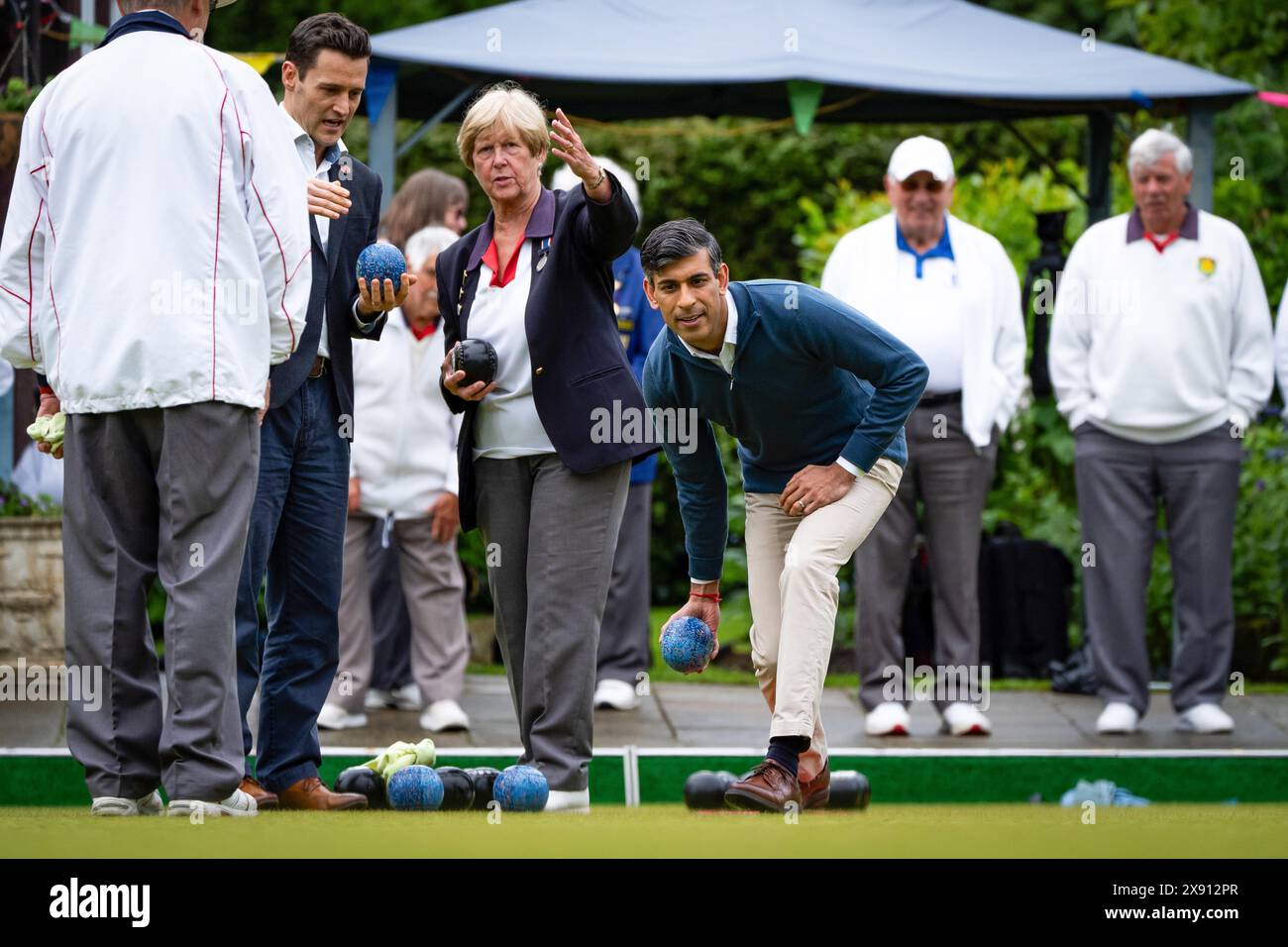 Prime Minister Rishi Sunak plays a game of bowls during a visit to ...