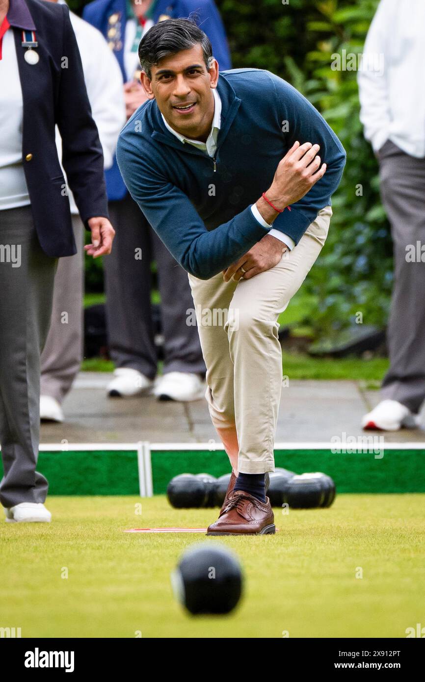 Prime Minister Rishi Sunak plays a game of bowls during a visit to ...
