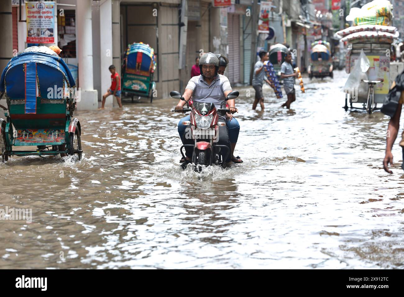 Dhaka, Bangladesh - May 28, 2024: Vehicles try to drive through a ...