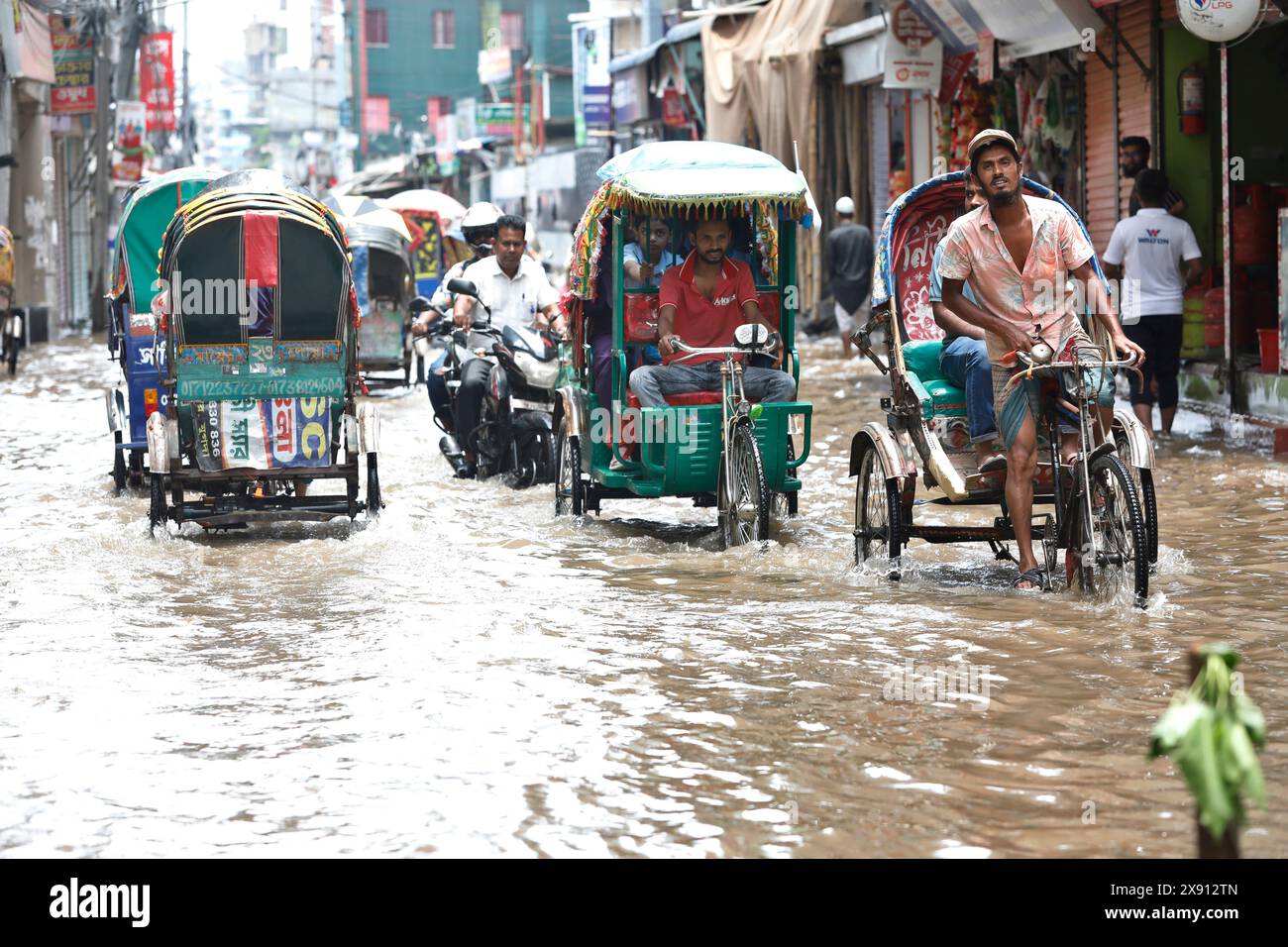 Dhaka, Bangladesh - May 28, 2024: Vehicles try to drive through a ...