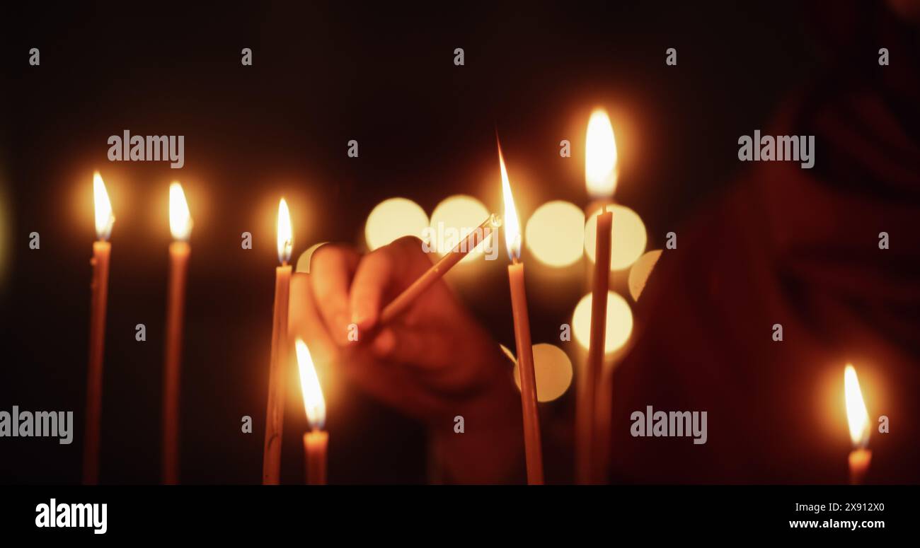 Close Up of Female Hands Lighting and Putting a Candle on an Altar in a ...