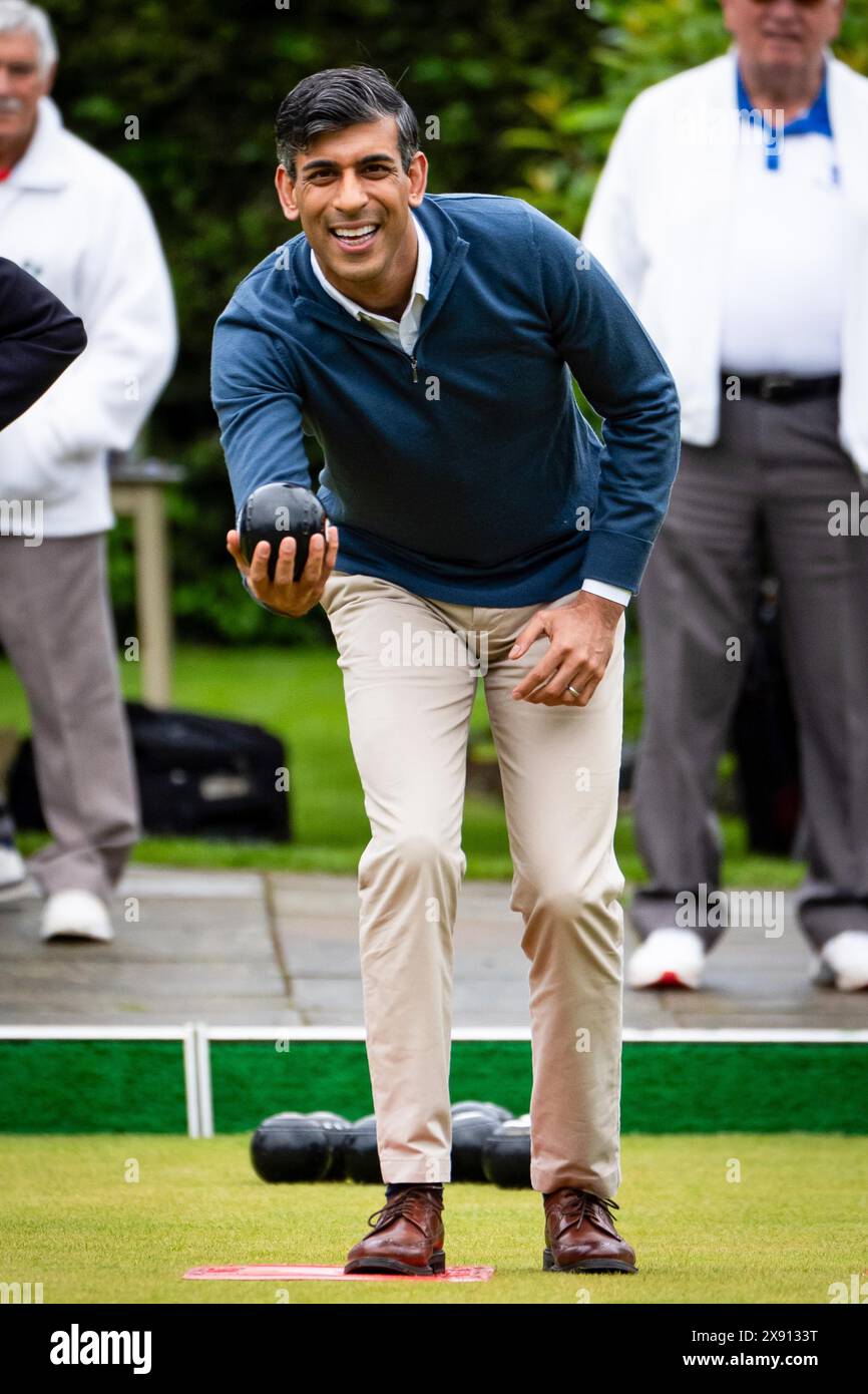 Prime Minister Rishi Sunak plays a game of bowls during a visit to ...