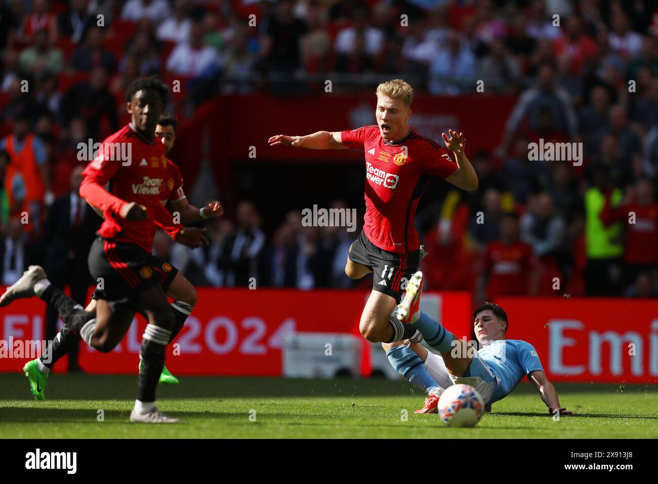 Rasmus Hojlund of Manchester United is fouled by Julian Alvarez of ...