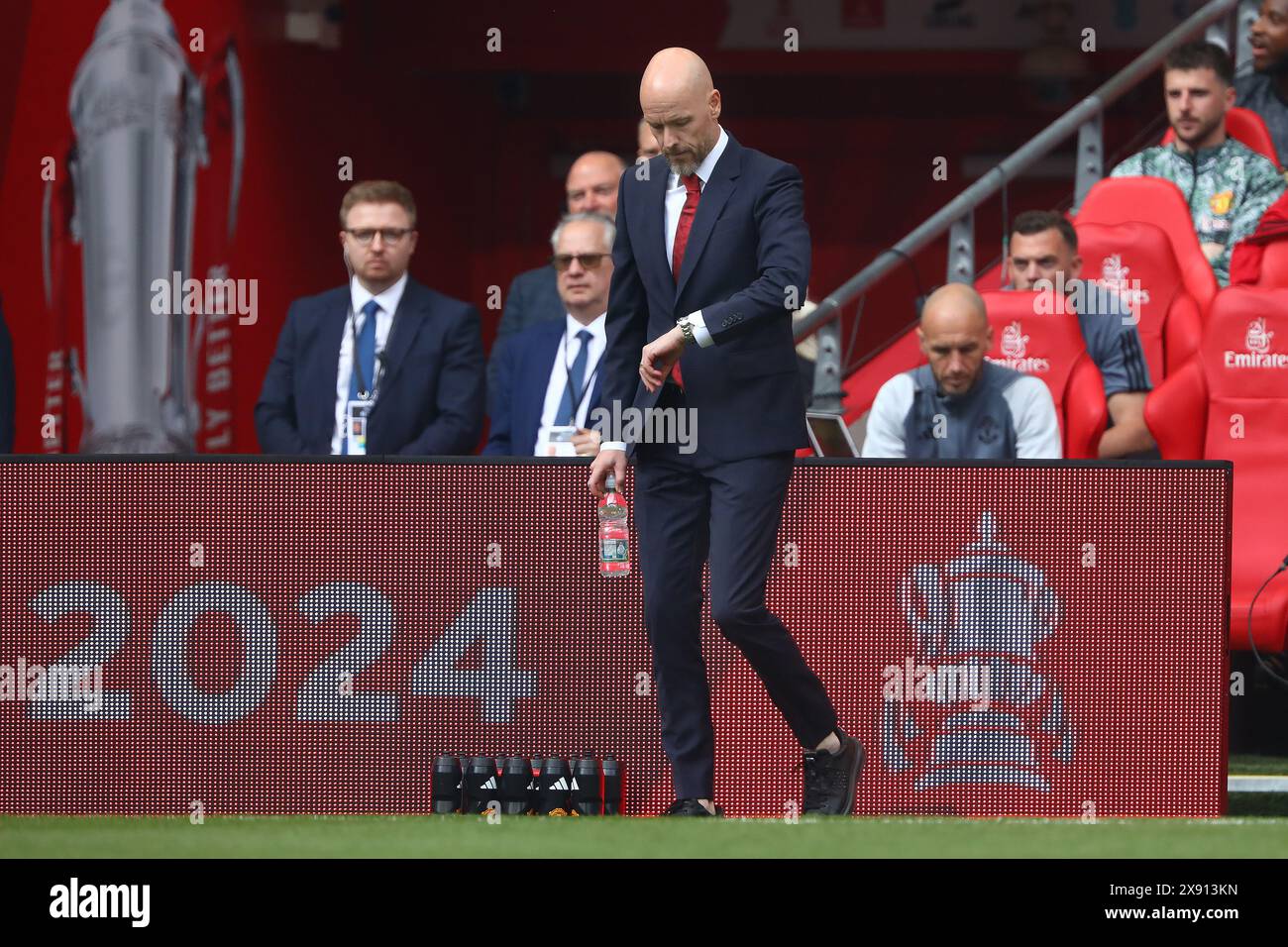 Manager of Manchester United, Erik ten Hag looks at his watch ...