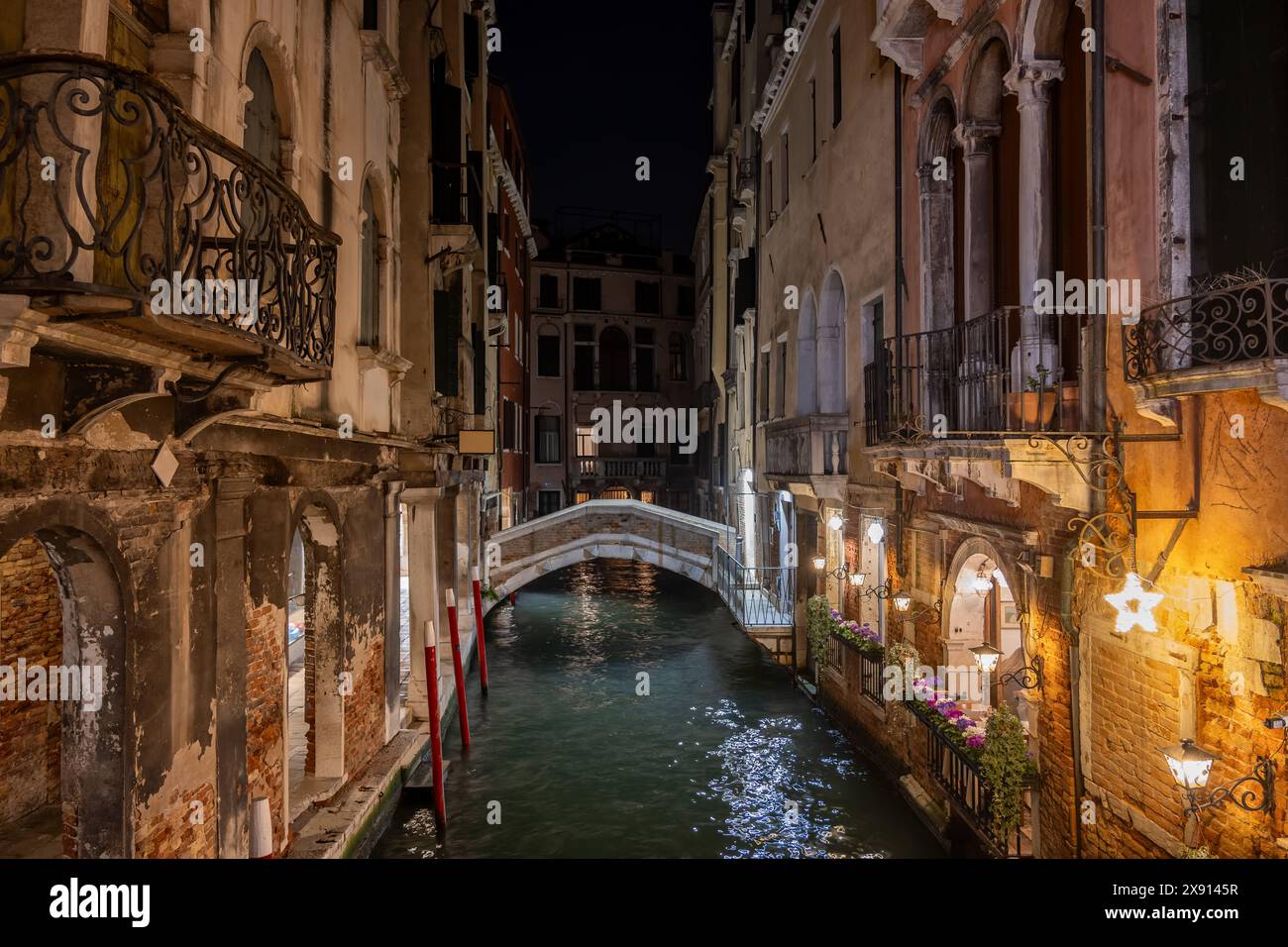 City of Venice at night in Italy. Atmospheric canal with aged buildings ...