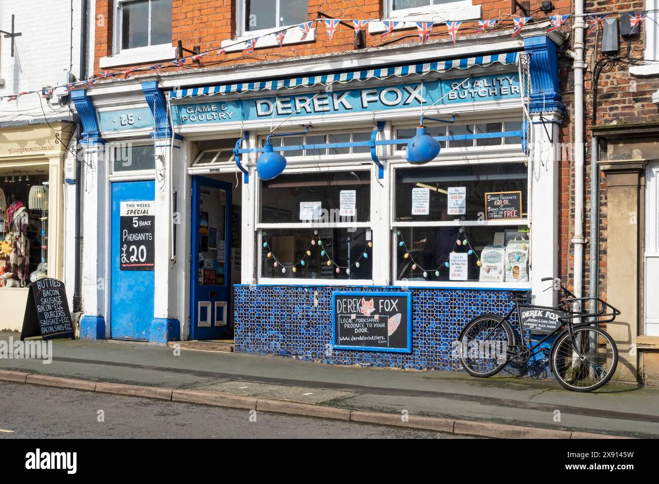Local independent butcher butchers shop store window exterior in the ...