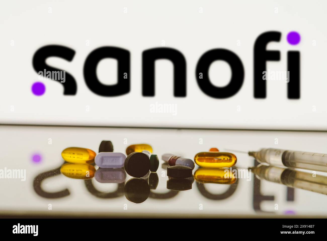 In this photo illustration, the Sanofi logo is displayed on screen in ...