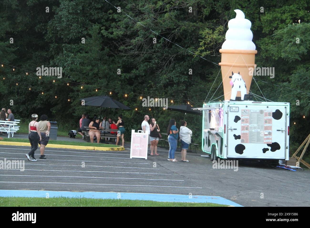 People waiting in line in front of an ice cream truck in the U.S.A ...