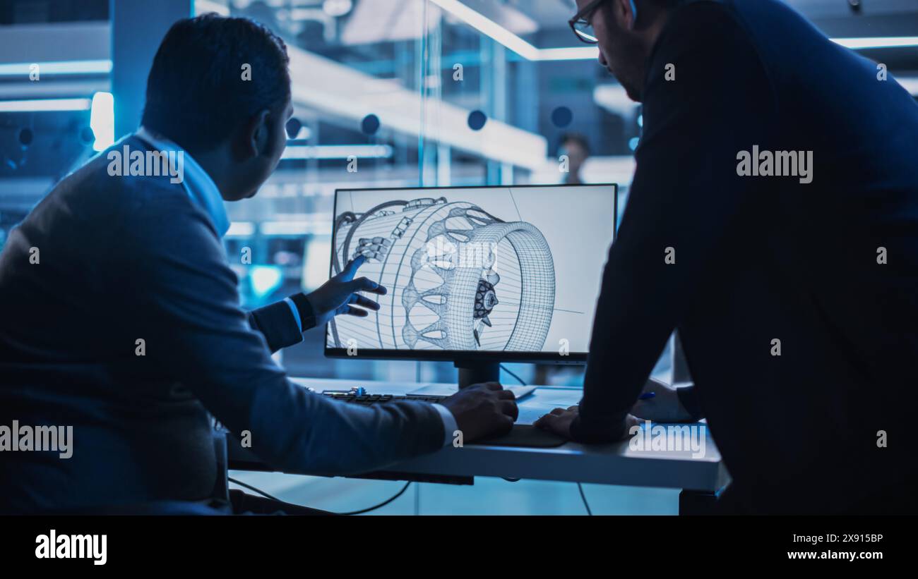 Two Developers Working on Computer with Green Screen Mock Up Display. Scientific Lab ...