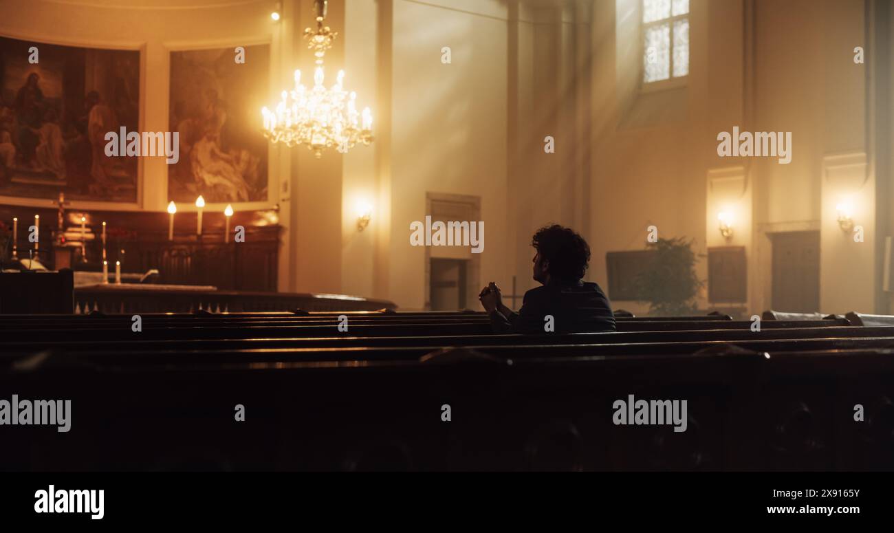 Young Christian Man Sits Piously in Majestic Church, with Folded Hands ...