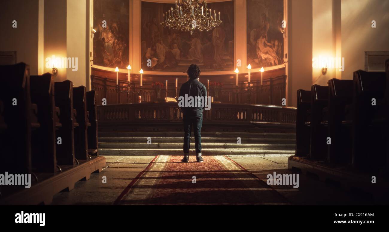 Back View: Christian Man Standing in front of the Altar and Starting to ...