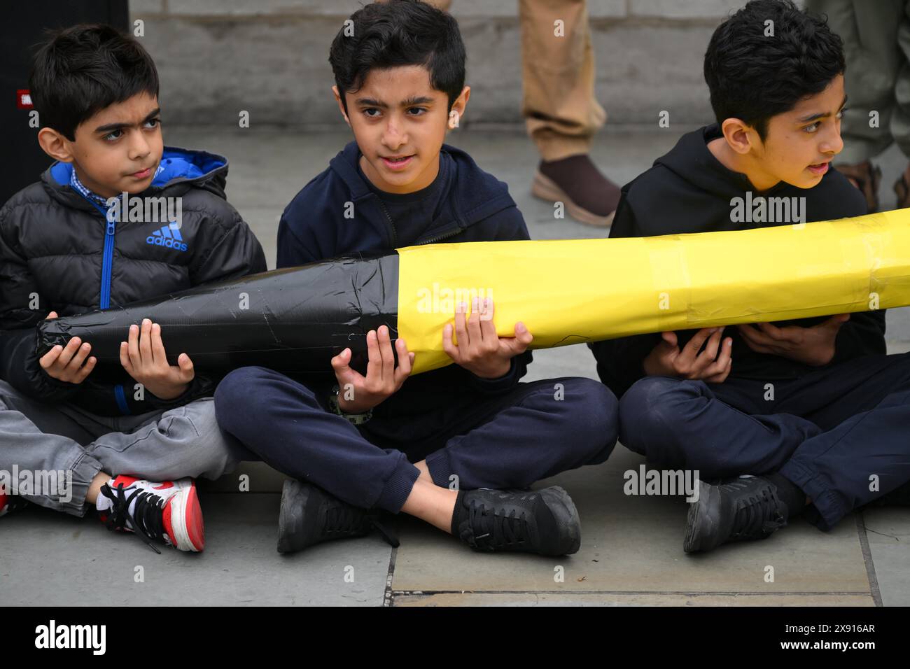 London, England, UK. 28th May, 2024. Children hold a makeshift nuclear ...