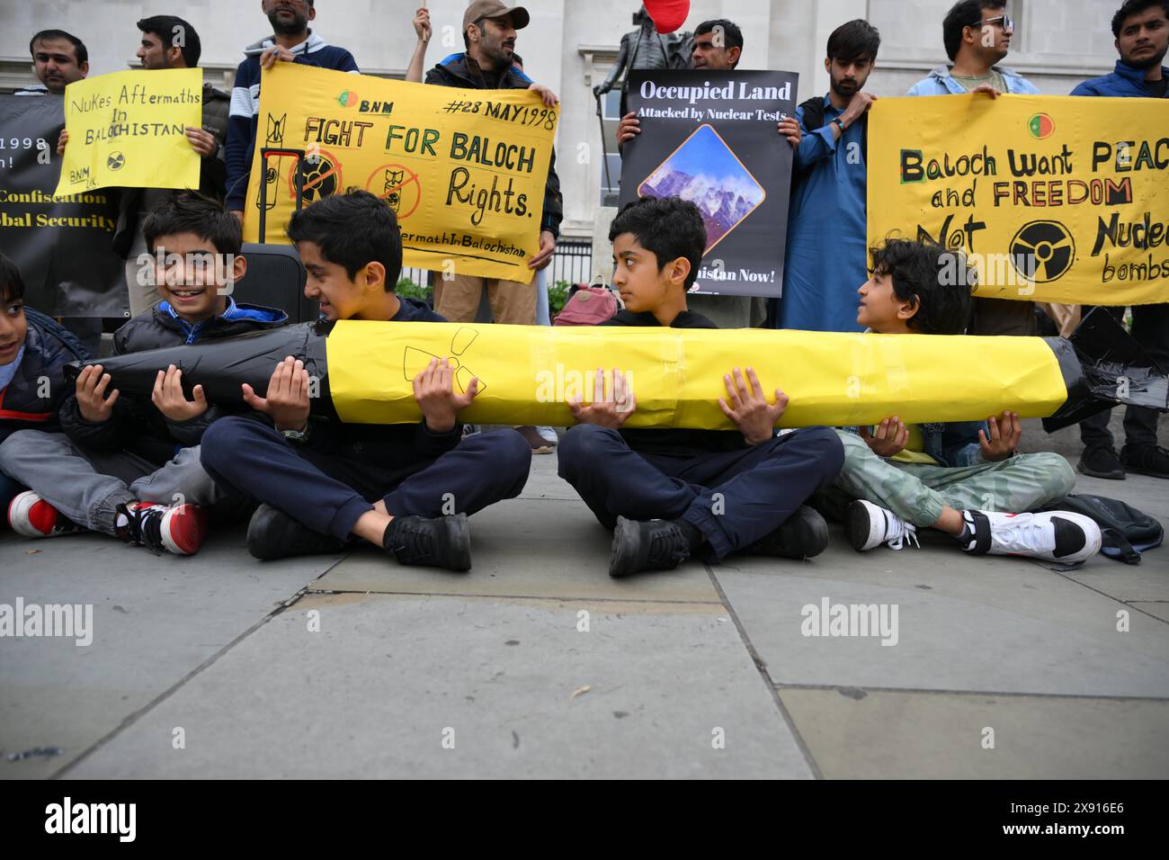 London, England, UK. 28th May, 2024. Children hold a makeshift nuclear ...