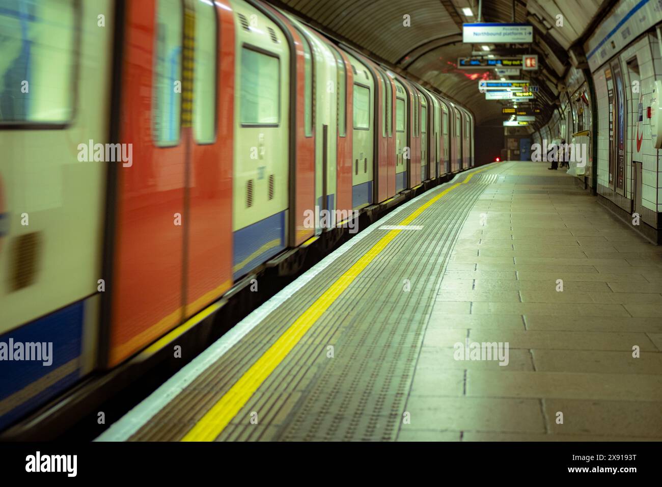 LONDON- Typical underground station with train at platform Stock Photo ...