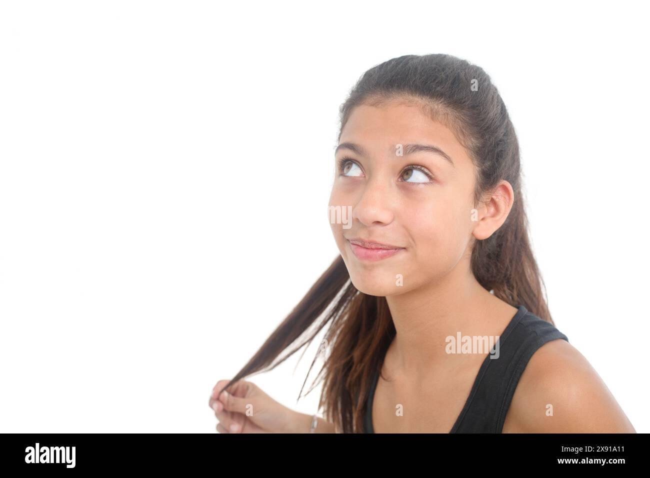 close up of intrigued teenage girl looking sideway to copy space on ...