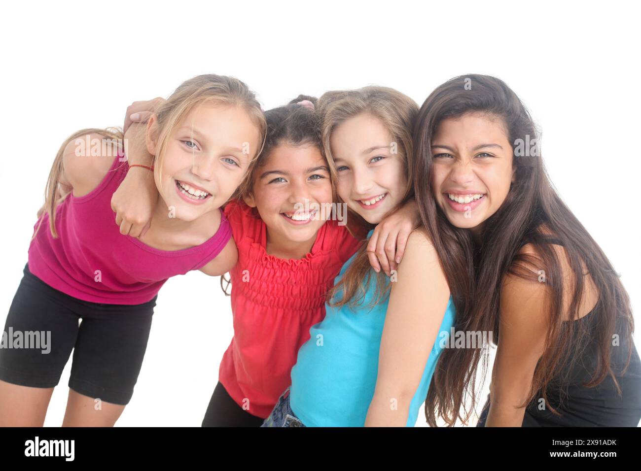 group of cheerful girls in colorful clothes hugging and smiling on ...