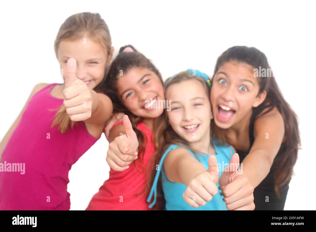 group of cheerful teenage girls showing thumbs up on white background ...