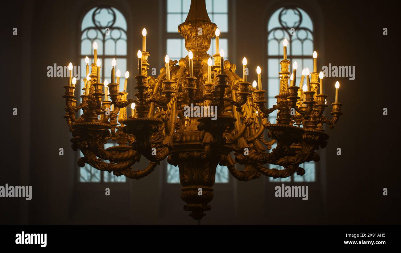 Close Up Shot of a Majestic Golden Chandelier Hanging from the ceiling ...