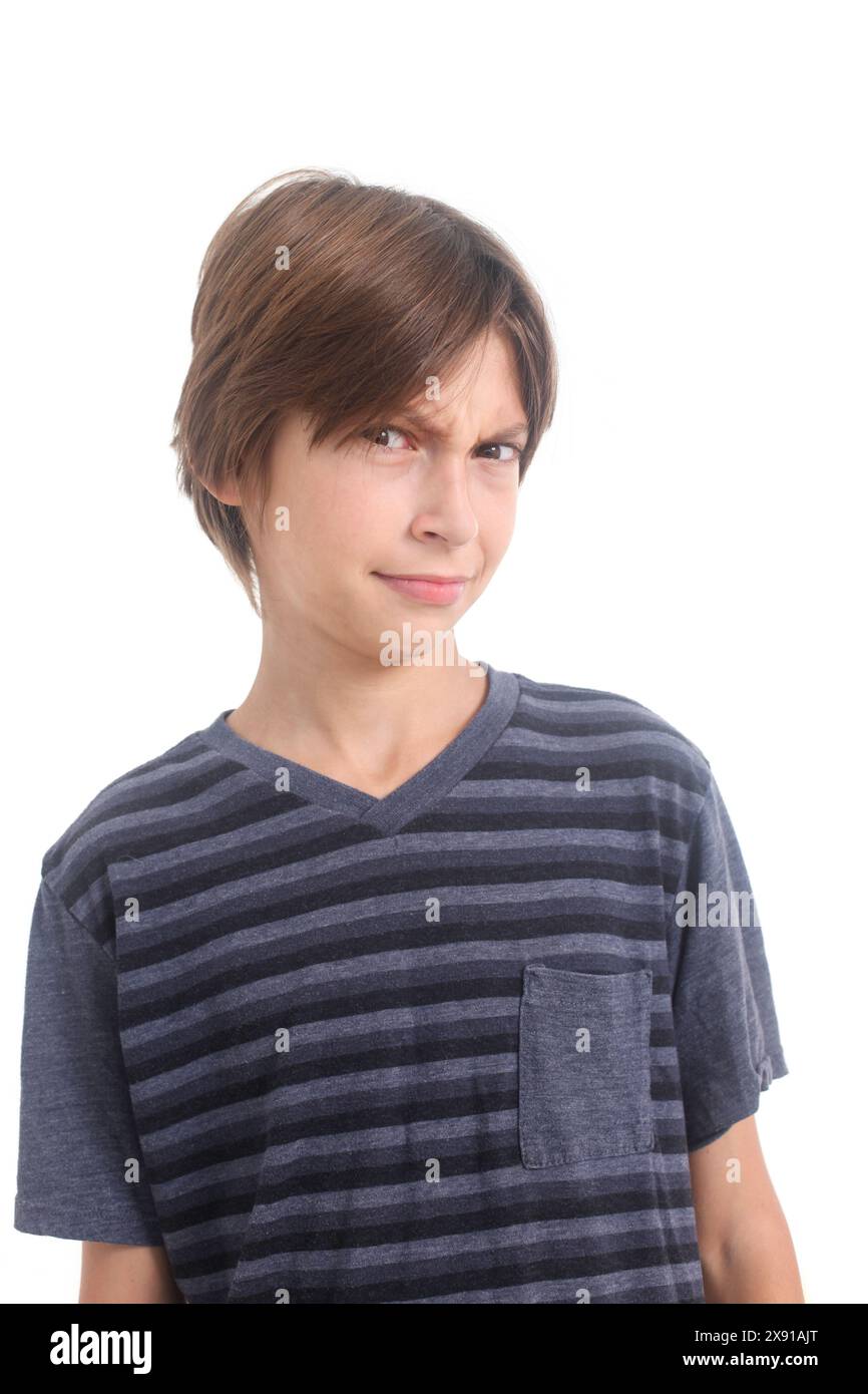 confused boy raising his eyebrow with funny face on white background ...