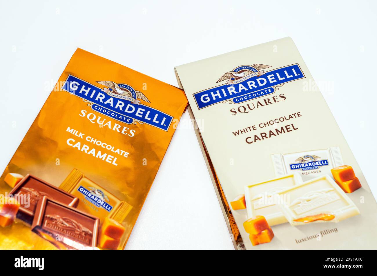 A bag of Ghirardelli Milk Chocolate Caramel Squares and White Chocolate ...