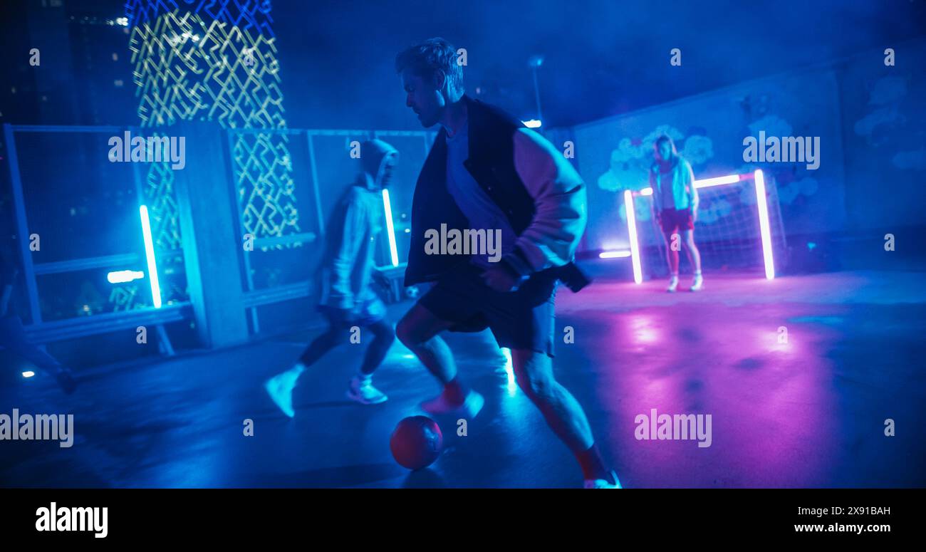 Man playing football night friends hi-res stock photography and images ...