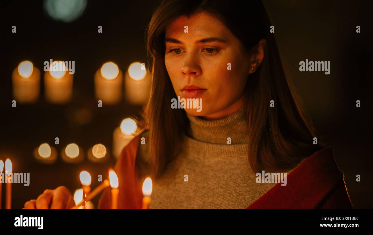 Aesthetic Shot of Young Christian Woman Lighting a Candle in Church ...