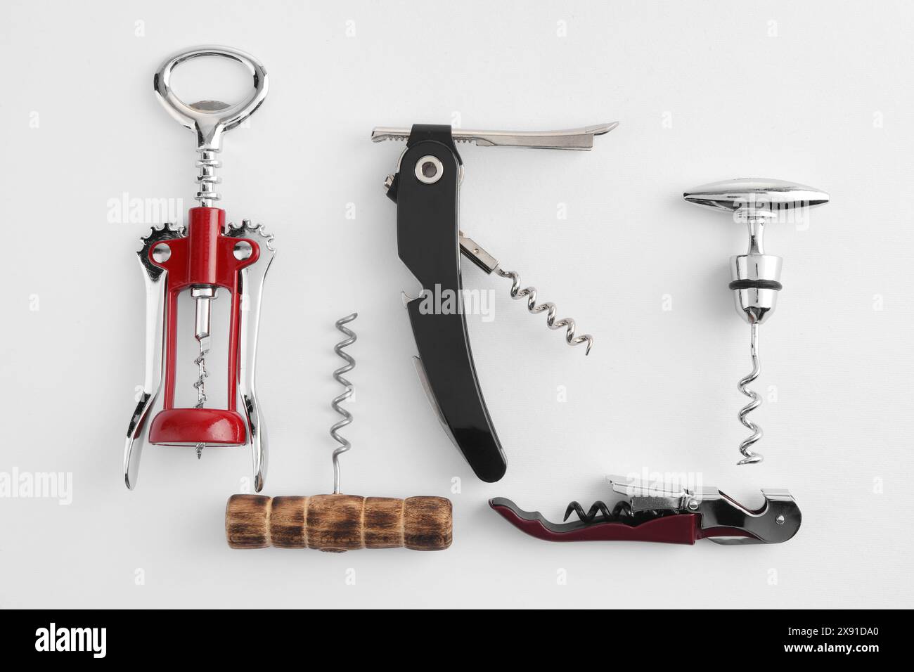 Different corkscrews on white background, flat lay Stock Photo - Alamy