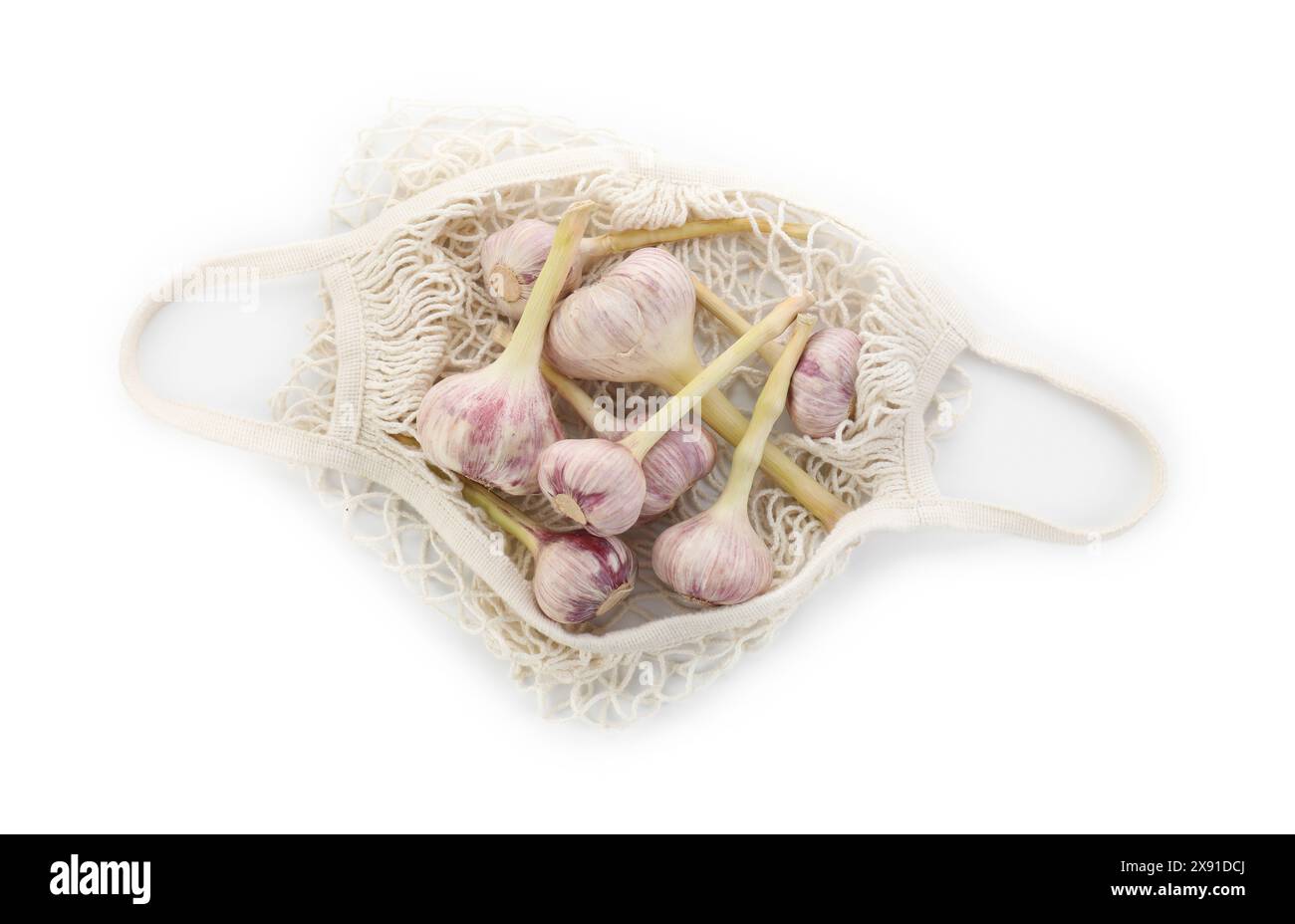 String bag with garlic isolated on white, top view Stock Photo - Alamy