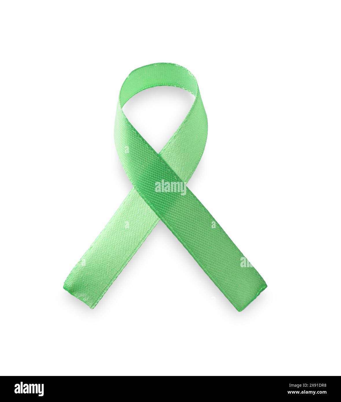 Light green awareness ribbon isolated on white, top view Stock Photo ...