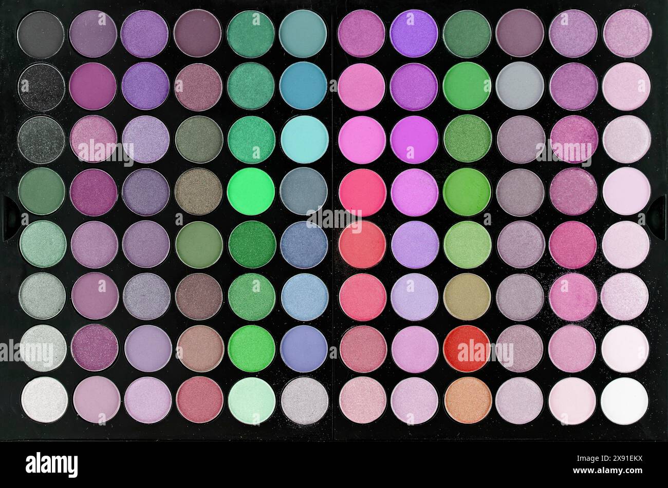 Vibrant eyeshadow palette featuring an array of colorful round shades ...