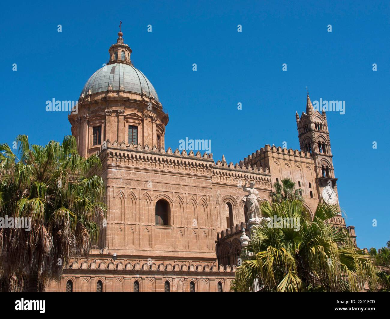 Majestic gothic cathedral with large dome and tower under a bright blue ...