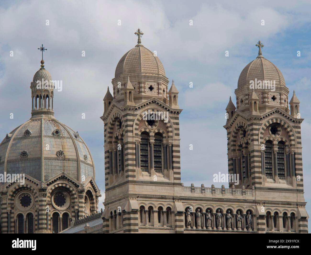 Detailed view of historic cathedral towers and dome in overcast sky ...