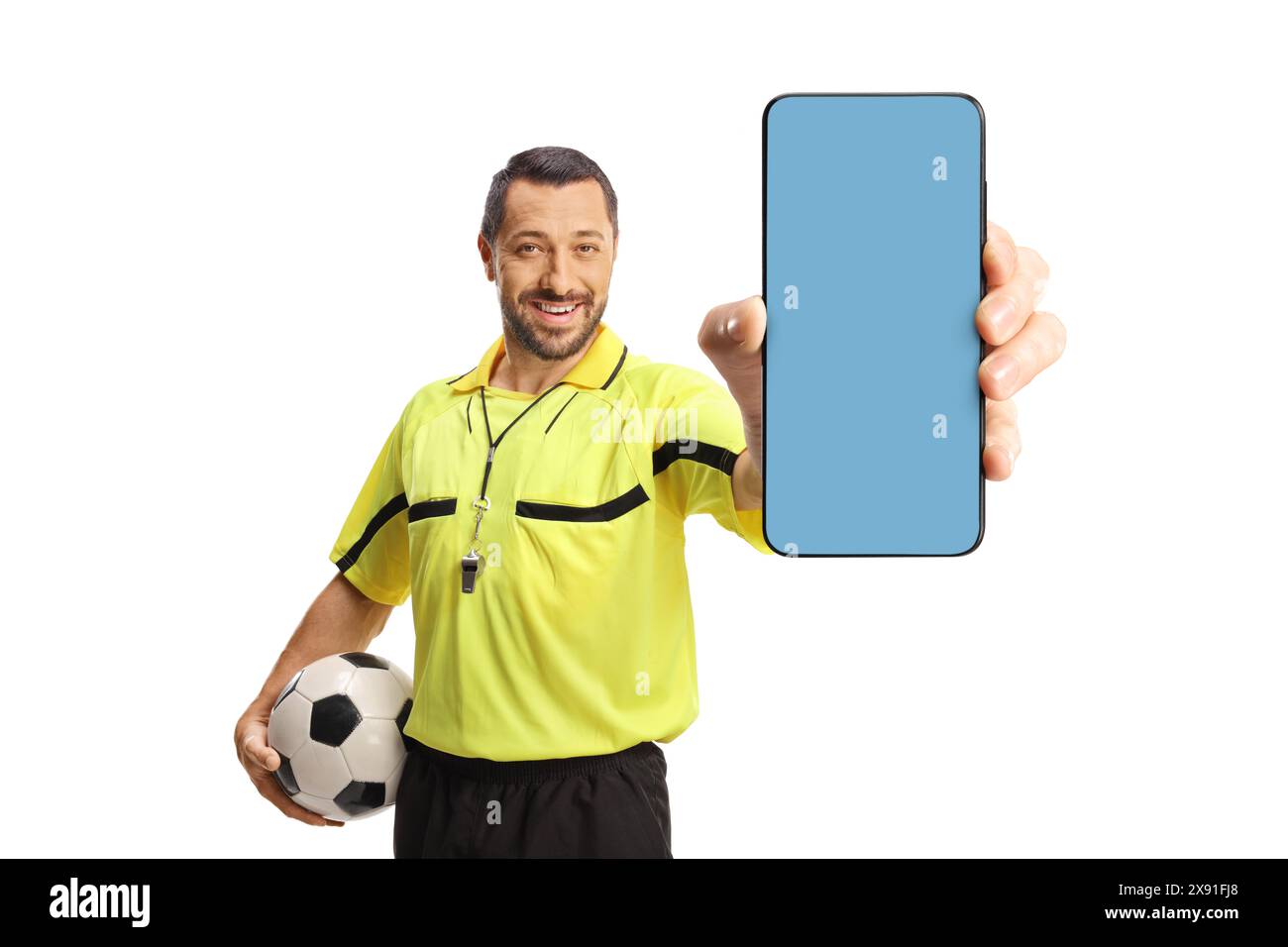 Football referee holding a ball and a smartphone with blue screen ...