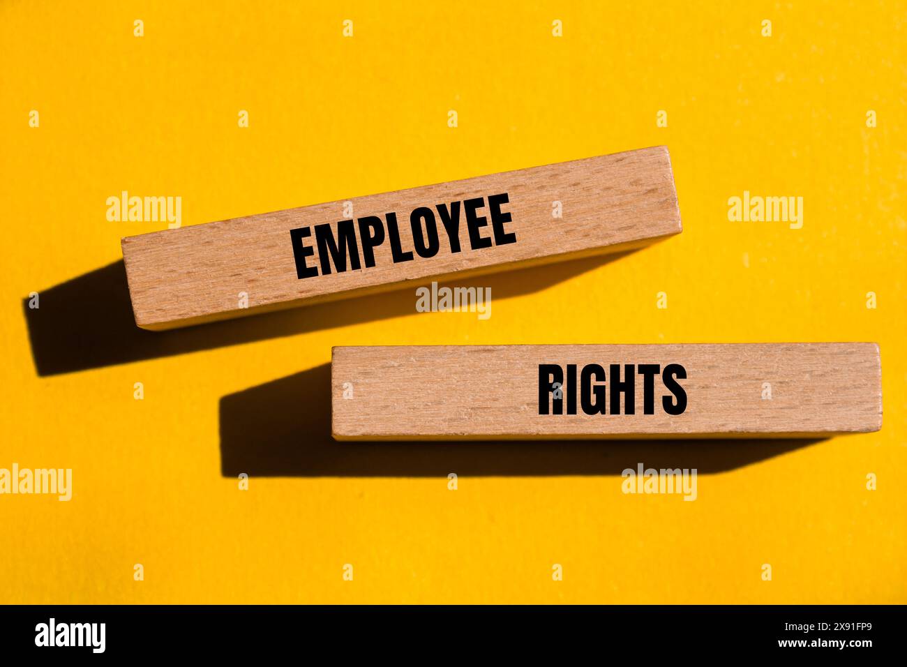 Employee rights words written on wooden blocks with yellow background ...