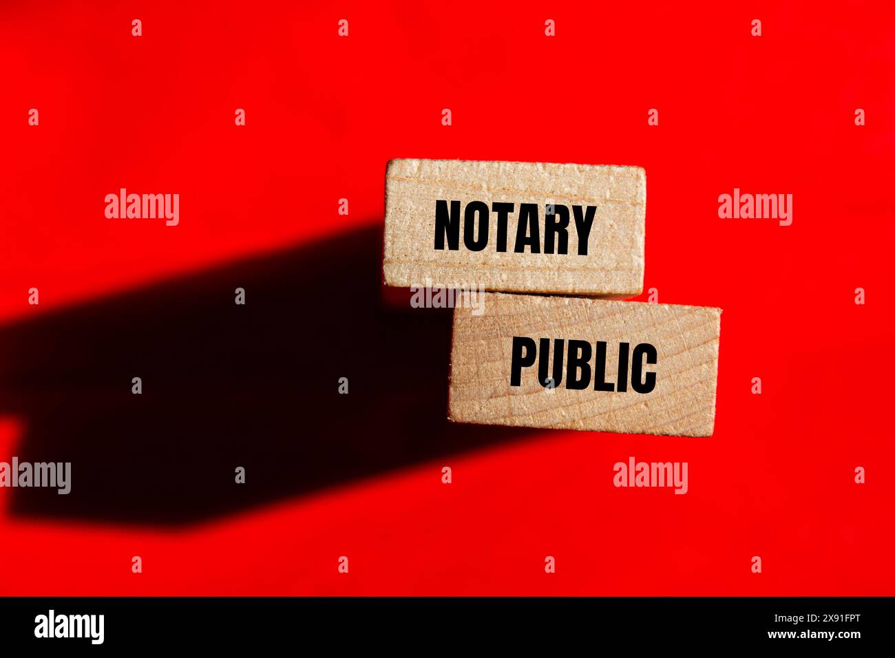 Notary public words written on wooden blocks with red background ...