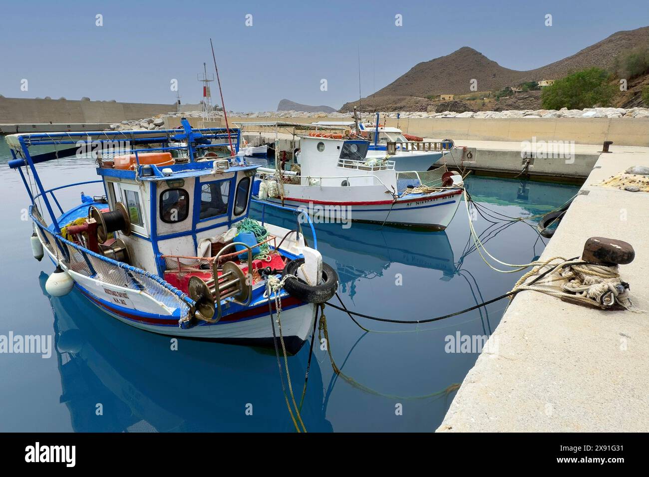 Two small fishing boats in new harbour marina of Loutra east of Lentas ...