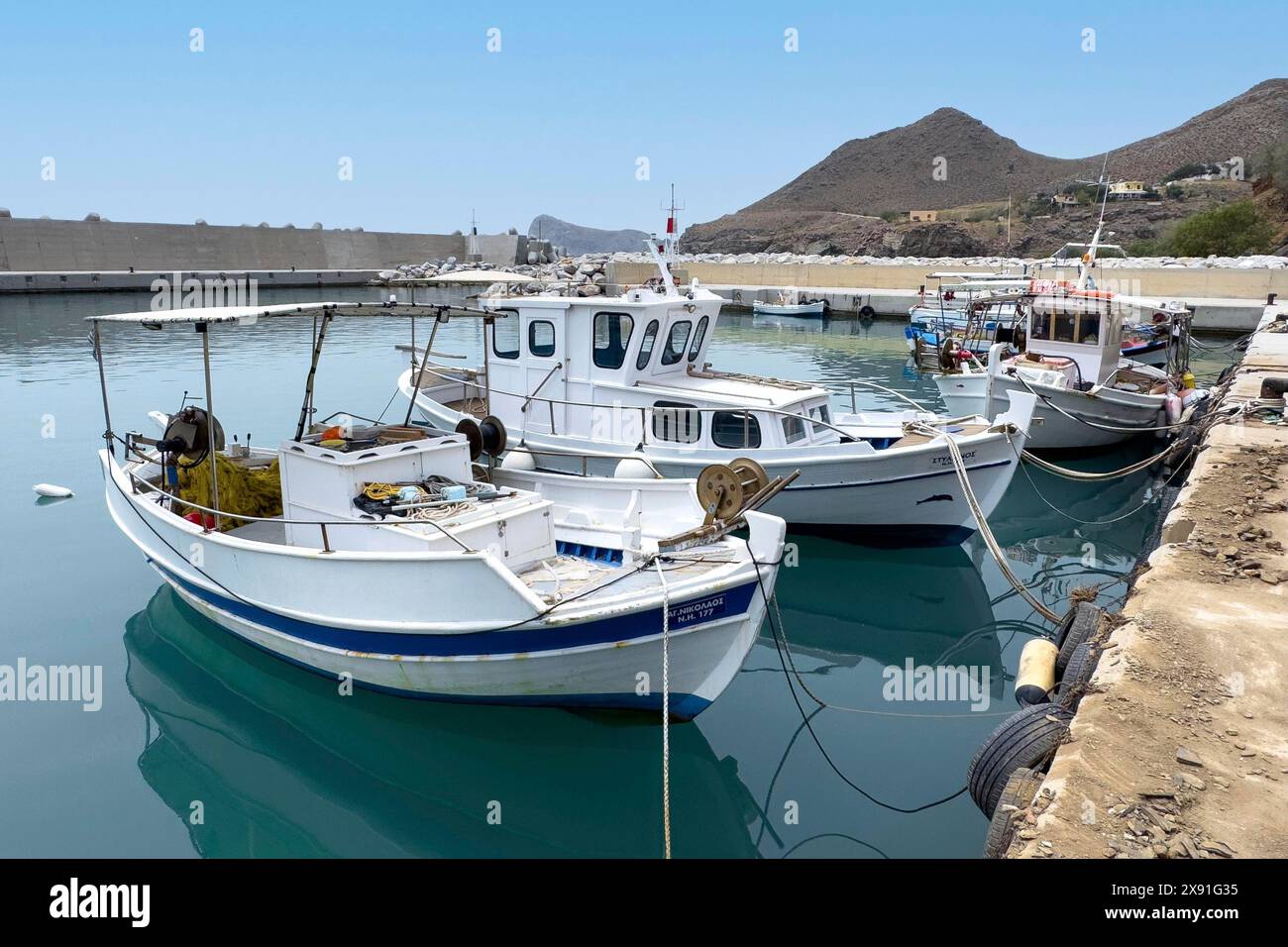 Fishing boats in harbour loutra hi-res stock photography and images - Alamy