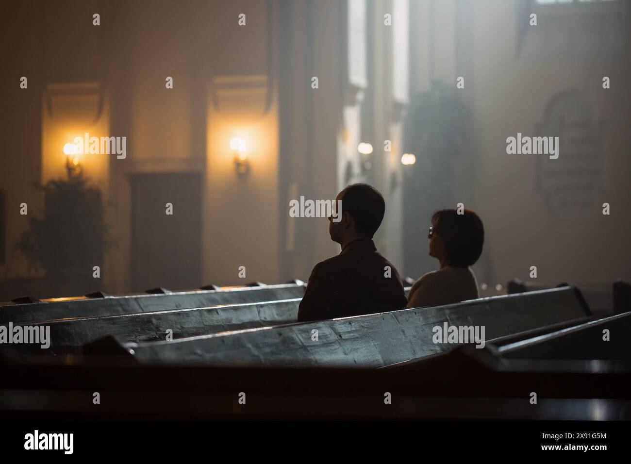 Two People Siting in Church, Praying And Feeling A Connection To God ...