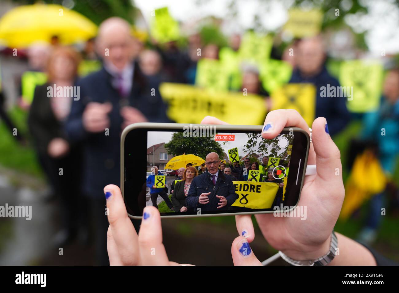 SNP Leader John Swinney doing media interviews as he goes canvassing ...