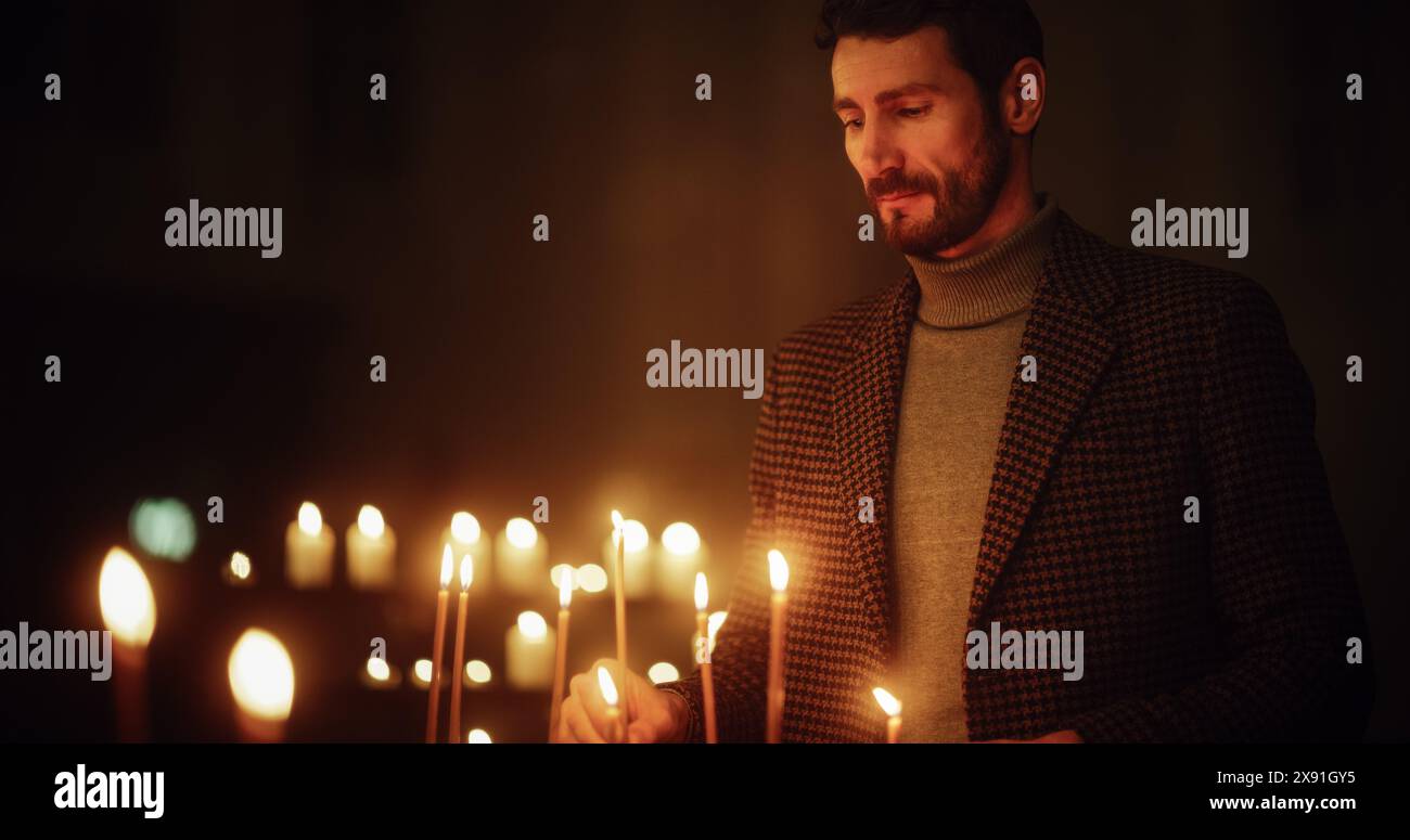 Devout Christian Man Lighting a Candle in Church, Praying and ...