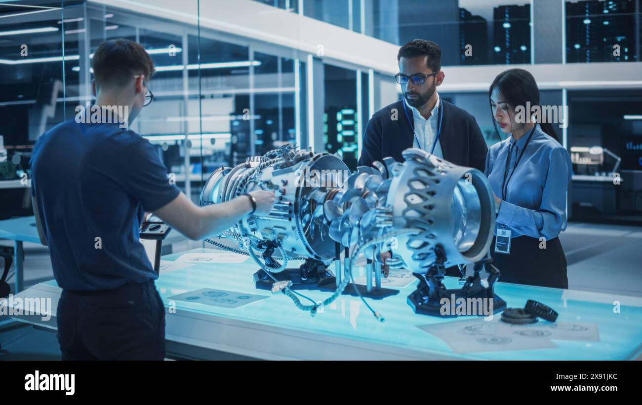 Young Team of Multicultural Engineers Use Blueprints, Tablet and Laptop ...