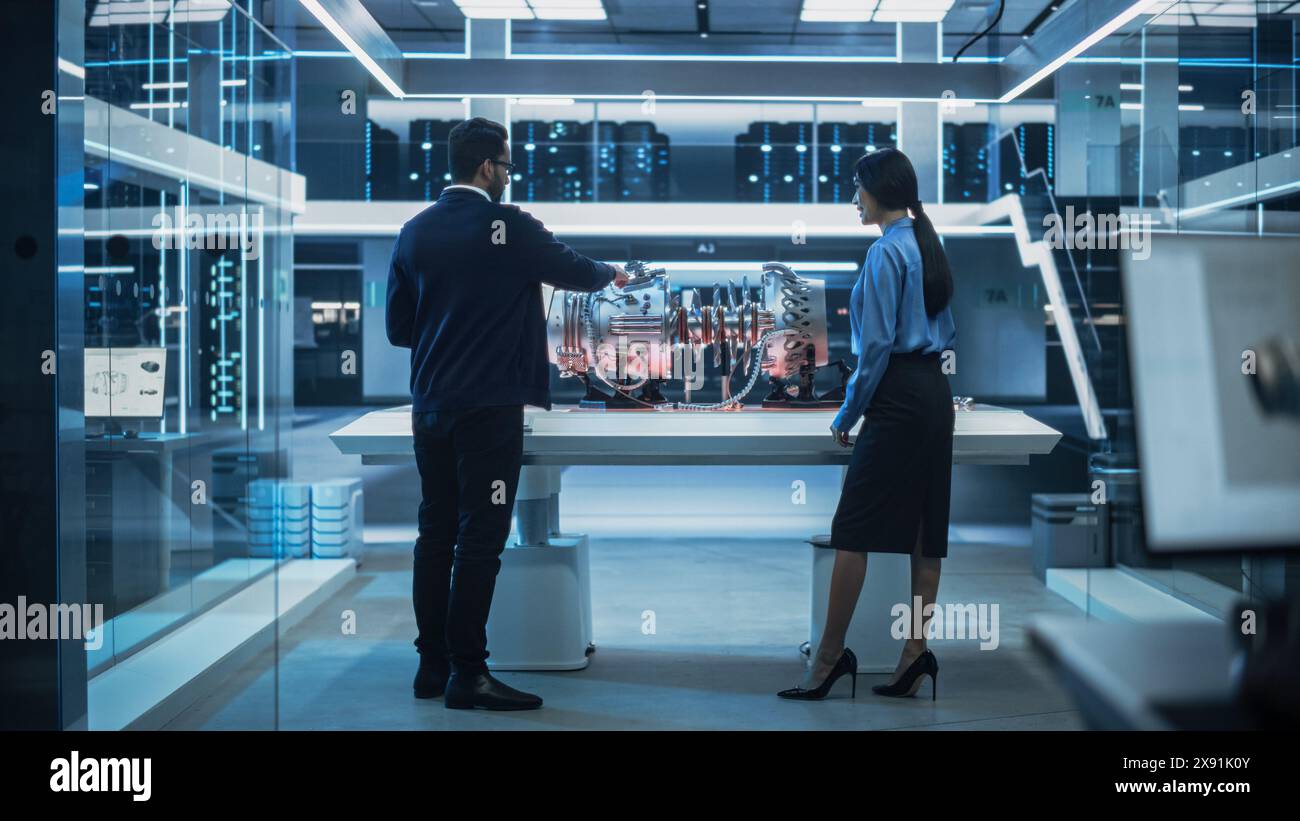 Two Diverse Engineers Working in High Tech Research Facility with a ...